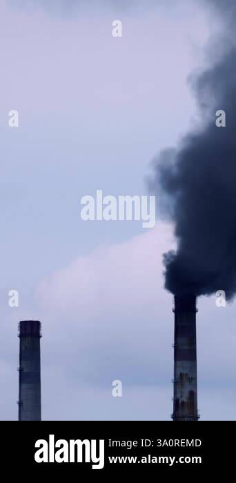 Factory pipe polluting air. Plant emits smoke and smog from the pipes ...