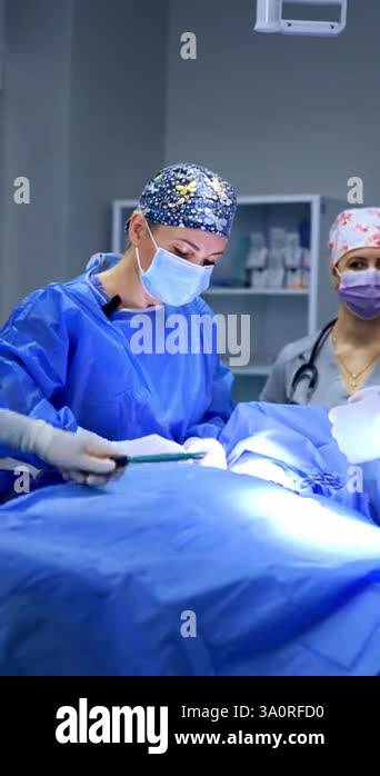 Female doctor stands at the patient preparing him for the surgery. Hand ...