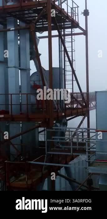 Huge elevator construction storage. Metal modern agricultural farm ...