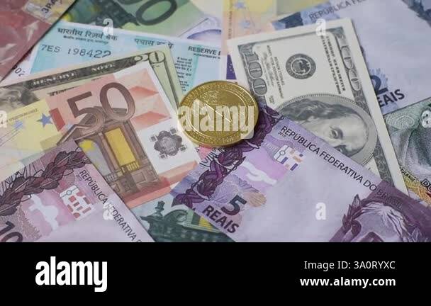 Round metal ethereum on a background of paper banknotes of different ...