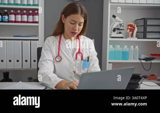 Young caucasian woman doctor in uniform checking time on wrist watch at ...