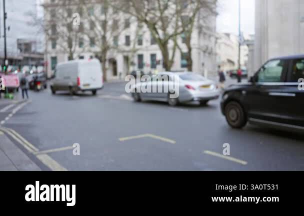 Blurry urban street scene in london during winter with cars and ...