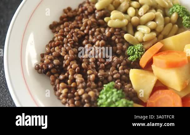 Vegetarian main course vegetables lentils, beans, potatoes, carrots ...