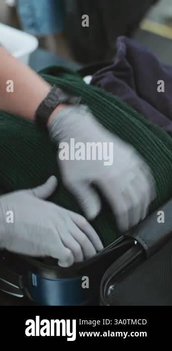 Security Checkpoint in Airport: Close Up of TSA Worker Inspecting ...