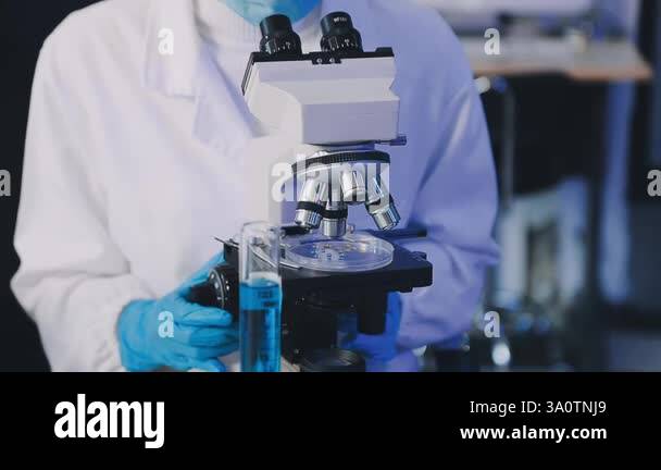 scientist in laboratory working in laboratory with microscope Stock ...