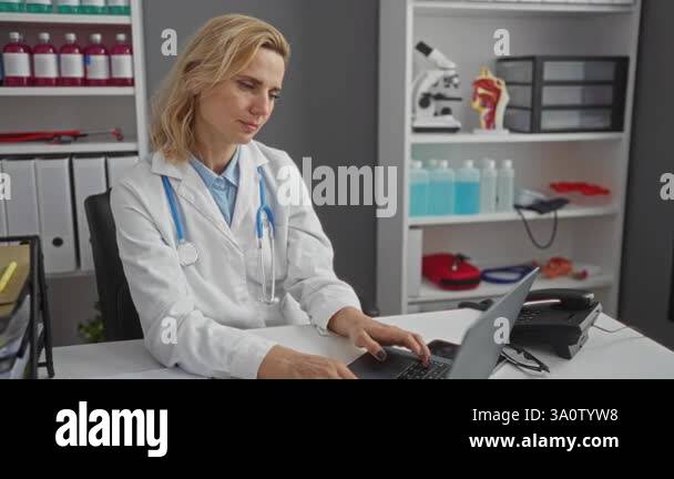 Female doctor working in clinic office with stethoscope examining ...