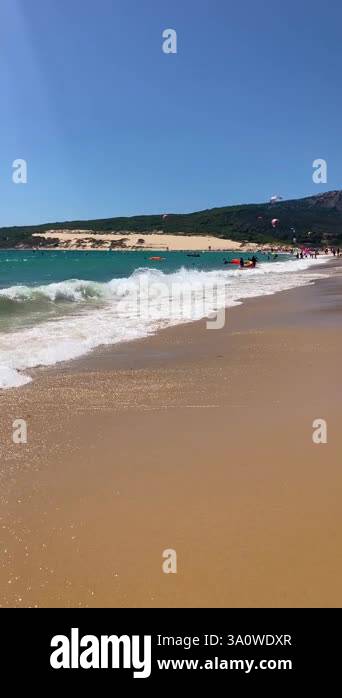 TARIFA, SPAIN - MAY 25, 2024: Enjoying kitesurfing on Valdevaqueros ...