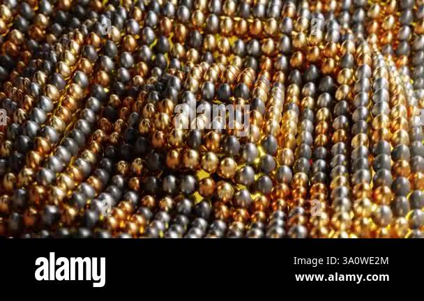 Looping 3D animation of multiple gold, silver, and bronze eggs in ...