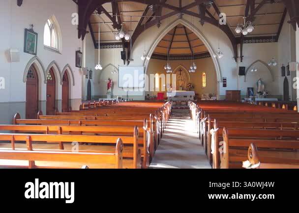 internal facade of a Christian Catholic chapel church with seats and ...
