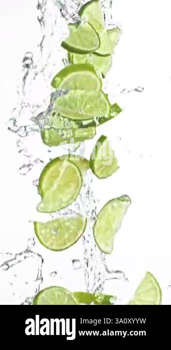 Super Slow Motion of Flying Lime Slices in Water Splashes, White ...