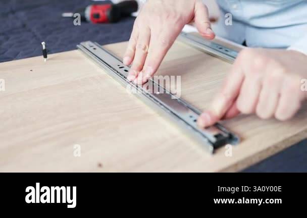 Professional Worker Furniture Assembler Controls the Operation of the ...