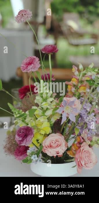 Vertical screen: A stunning floral centerpiece beautifully showcasing a ...