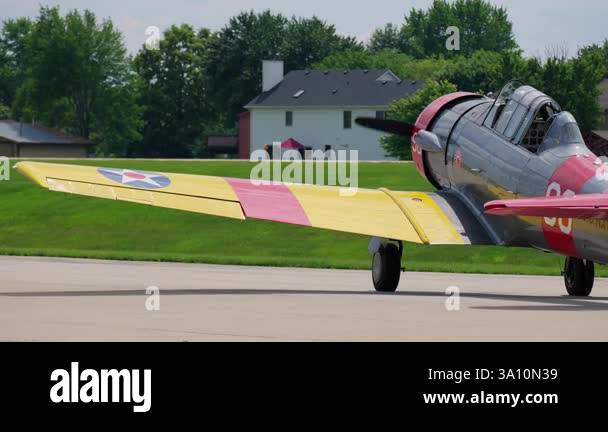 A propeller plane is going on the runway at the small airport ...