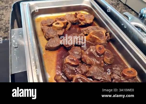 Trays on the buffet line are heated and ready to be served. Catering ...