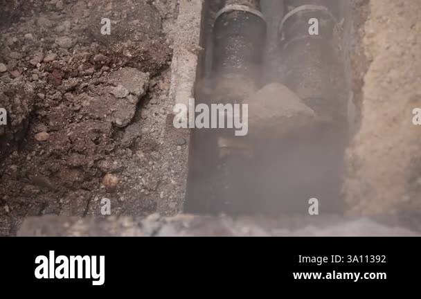 Leaky steam heating line or heating pipeline. Vapor seen rising up from ...