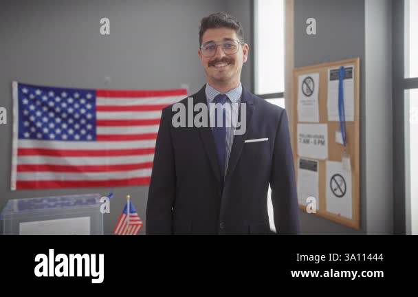 A confident man in a suit pointing at the camera with american flags in ...