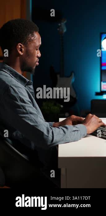 Vertical Video Young programmer engineer writing binary code data on terminal window, doing ...