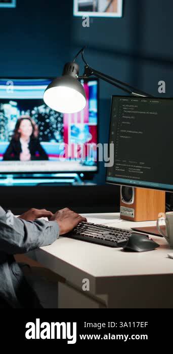 Vertical Video African american expert at desk using pc for programming ...