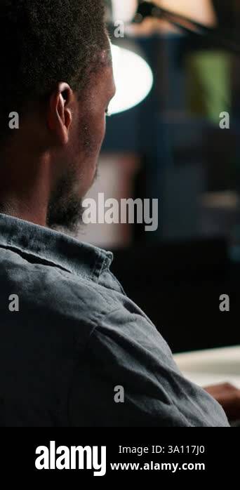 Vertical Video Male developer entering binary data on terminal panel while writing html code ...