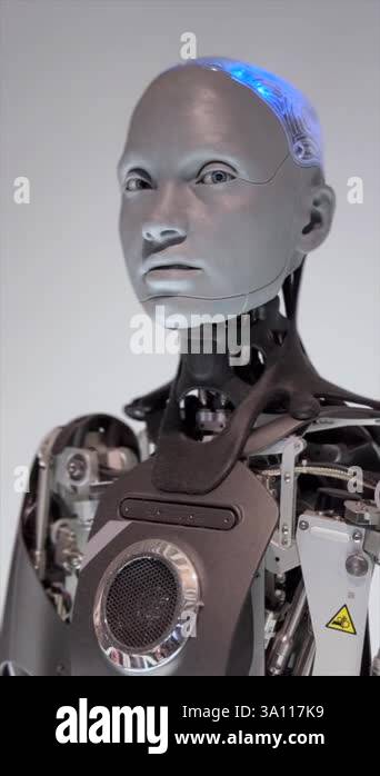 Vertical screen: Humanoid robot pivoting smoothly, transparent skull ...