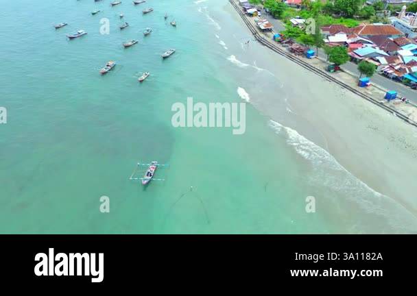 Natural view of Indonesian beach with white sand and blue sea on a ...