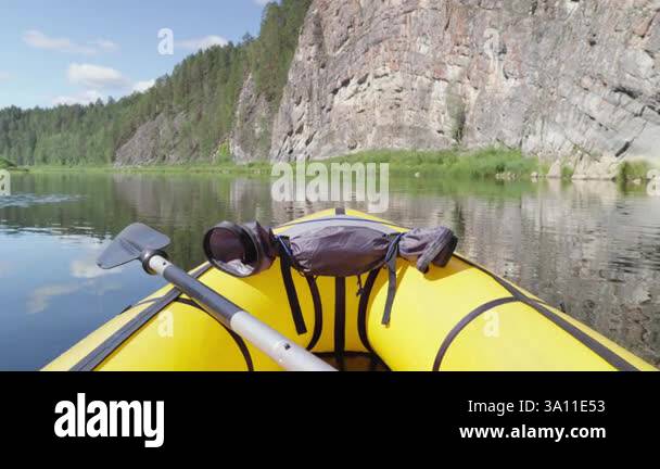 River rafting in summer. Packrafting on calm river. First person view ...