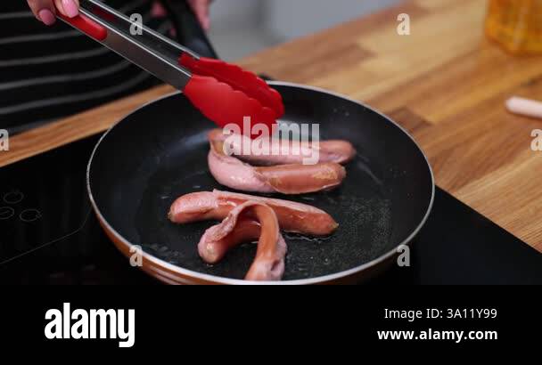 Woman turns hot sausages Stock Videos & Footage - HD and 4K Video Clips ...