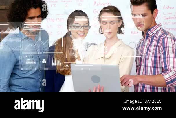 Diverse team collaborating on laptop with data processing animation overlay. Teamwork ...