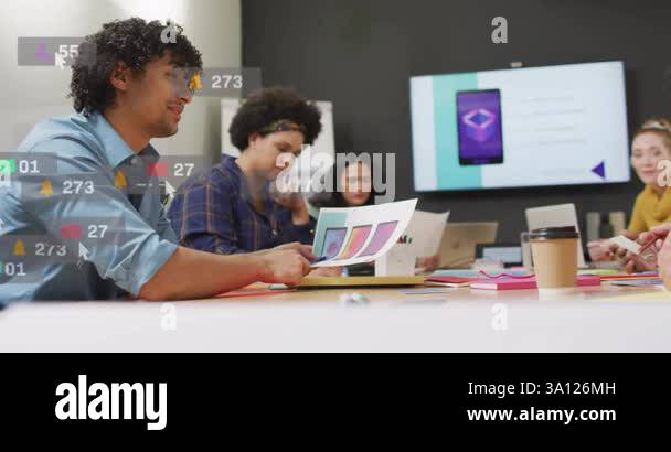 In school, diverse team creating animation, discussing design ideas in classroom. Collaboration ...