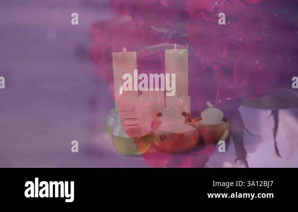 Candles and essential oils with dictionary text overlay on pink ...