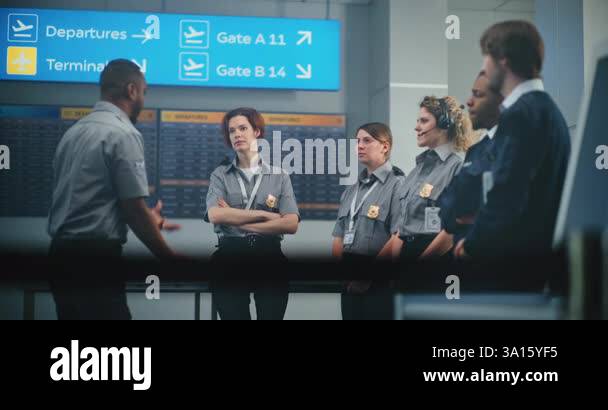 Airport Staff Briefing: African American Security Officer Conducting ...