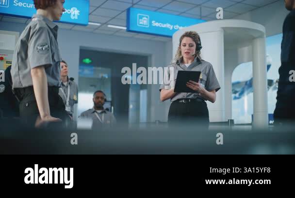 Airport Security System: Female Security Officer in Headset with Tablet ...