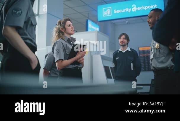Airport Staff Briefing: Female TSA Officer with Tablet Computer Wearing ...