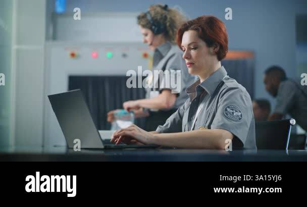 Airport Security Checkpoint: Female Security Officer Working on Laptop ...