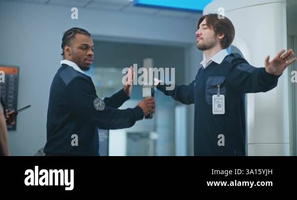 Airport Security Staff: African American TSA Officer Conducting ...