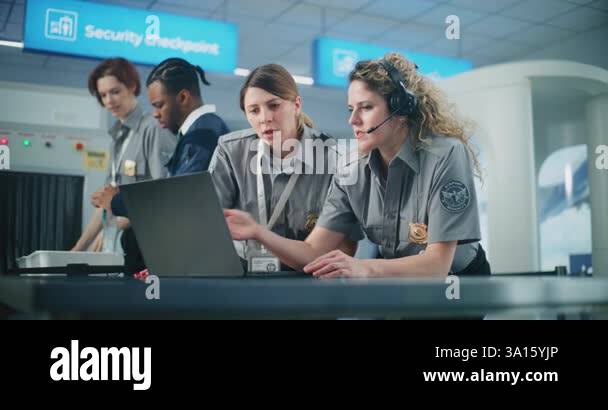 Airport Security Checkpoint: Female TSA Officer Wearing Headset Uses ...