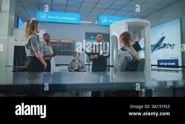 Airport Security Staff: African American TSA Officer Conducting ...