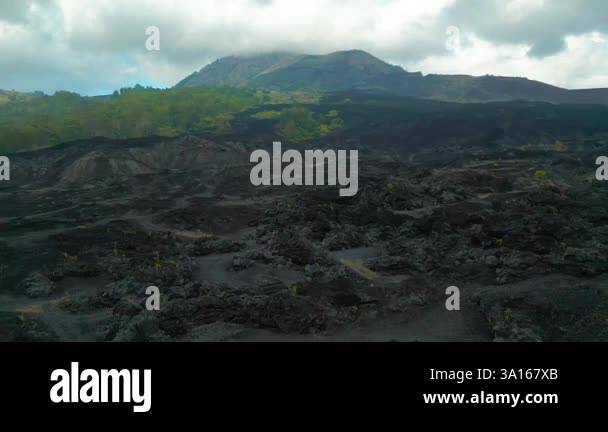 Aerial view showcasing the vast black lava fields surrounding Mount ...