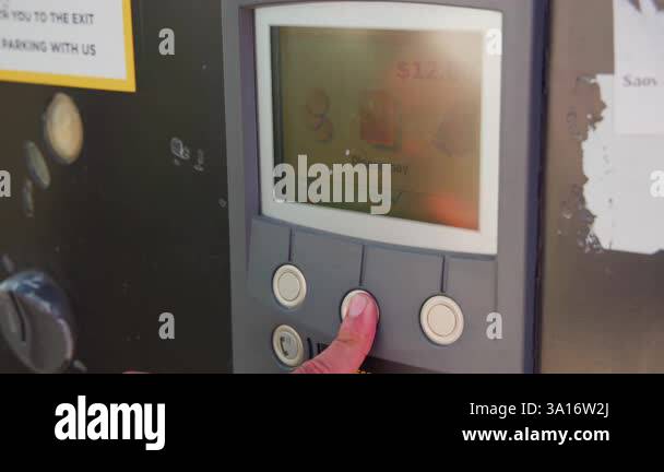 Hand Enter data on the parkomat machine. Parking, device, pressing buttons, parking lot. 4K high ...