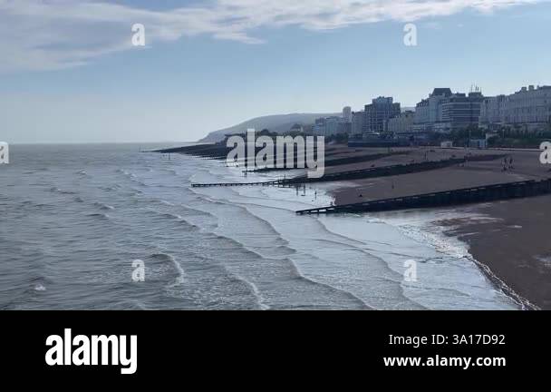 Eastbourne in East Sussex in United Kingdom, waves gently lapping the ...