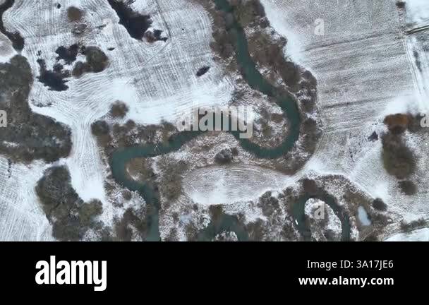 Inland river winter snow delta river ice frost meanders freezing drone ...