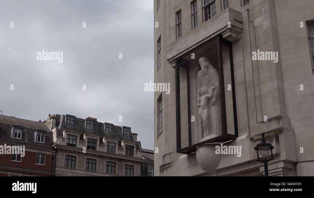BBC unveils restored Eric Gill statue Stock Video Footage - Alamy