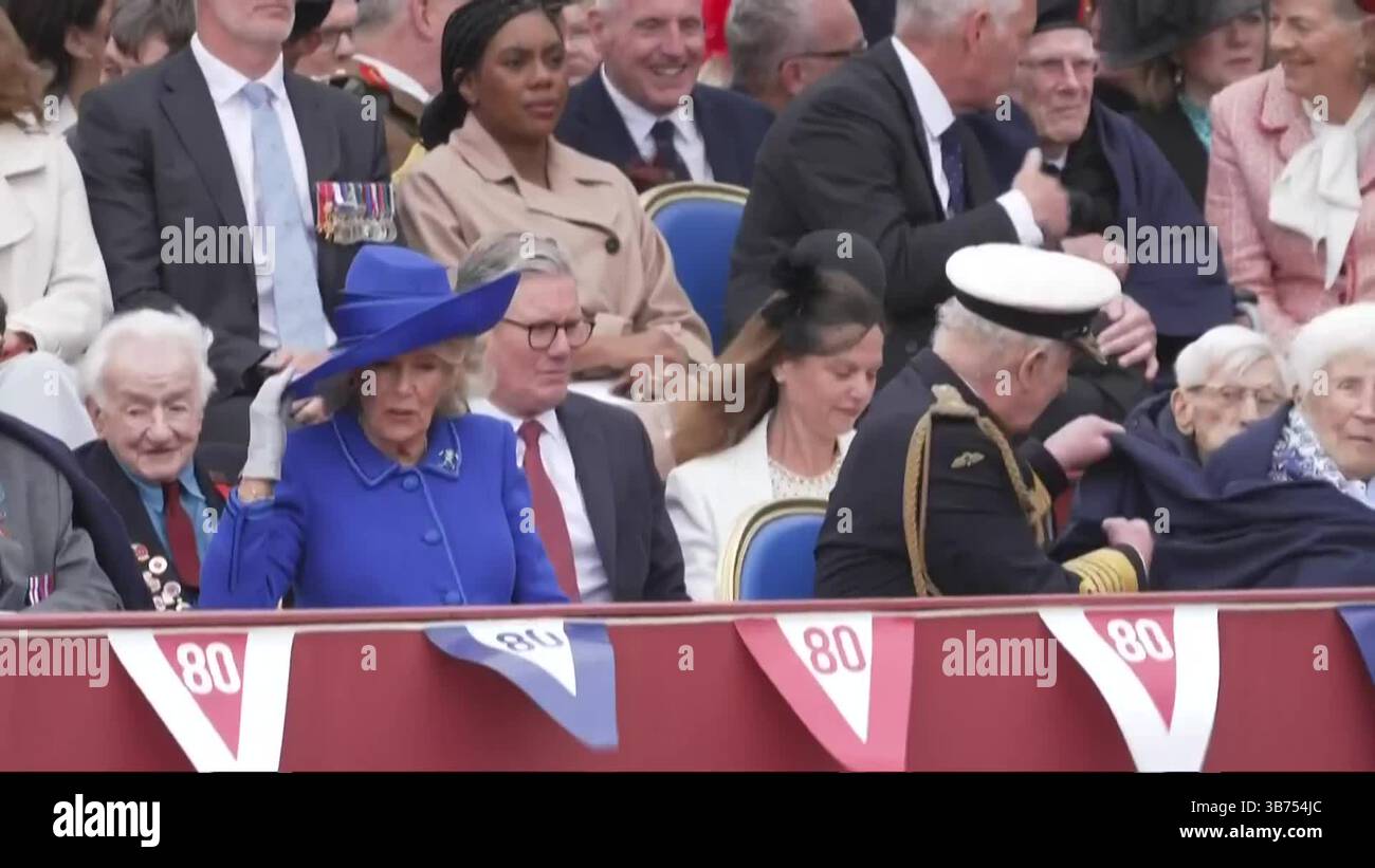 King helps adjust the blanket of veteran Joy Trew during the VE Day ...