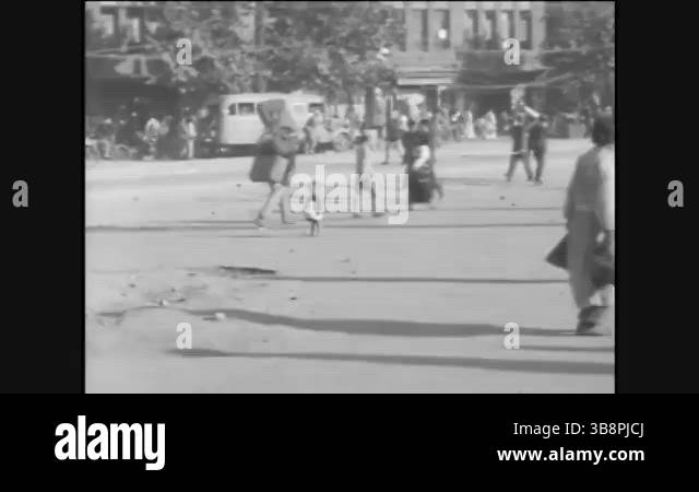 SOUTH KOREA - 1945 - People pass by and ignore lone crying infant in ...