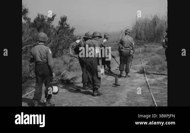 FRANCE - 1944 - US military engineers clear mines and troops pass ...