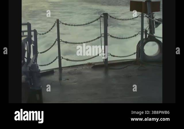 VIETNAM - 1965 - Sailors close an open deck hatch on board the USS ...