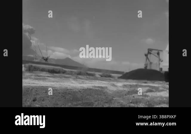 ITALY - 1944 - Bulldozers push lava ash off road as Mt Vesuvius erupts ...
