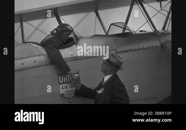 USA - 1937 - Men including Henry Ford shake the hand of an airmail ...