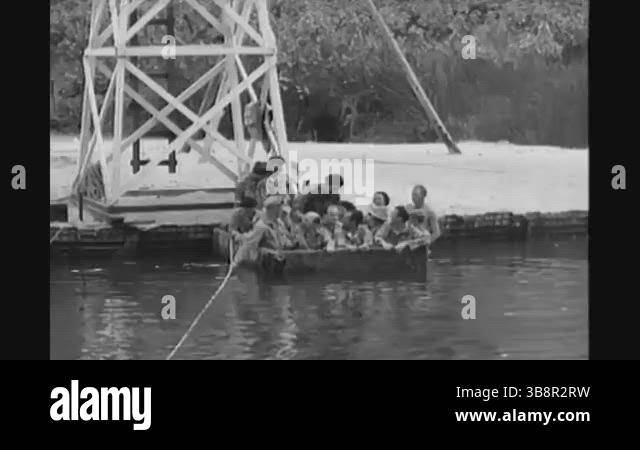 HAWAII - 1945 - USO troupe crosses on raft at the Pacific Jungle Combat ...