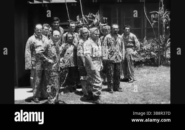 HAWAII - 1945 - Moss Hart and USO troupes in camouflage get into jeep ...